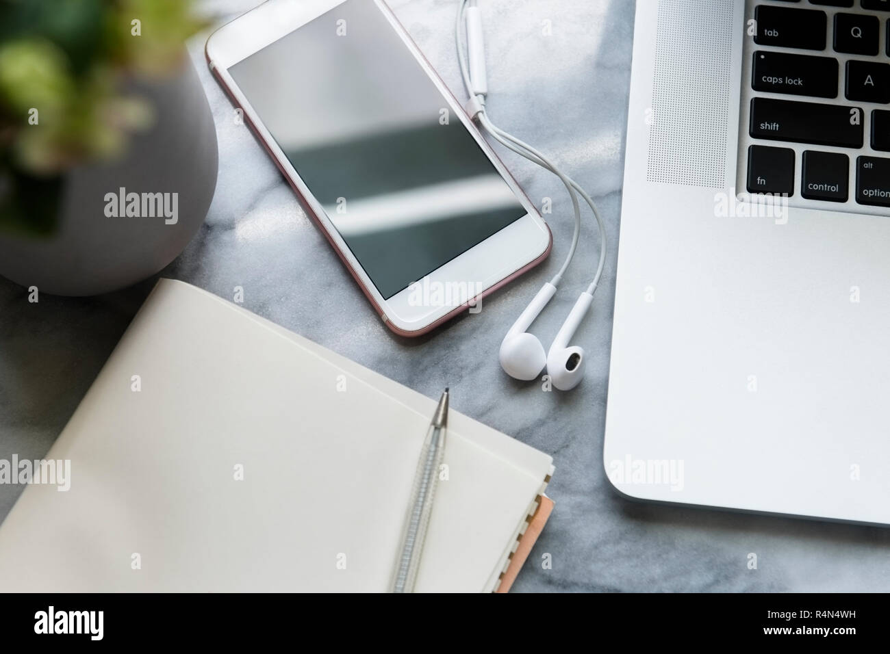 Smart phone, laptop, and note pad Stock Photo - Alamy
