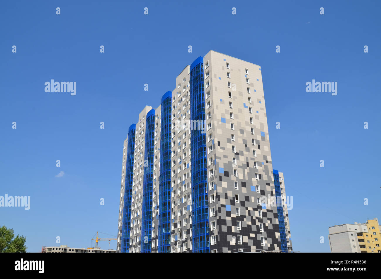 The new house revetted with a multi-colored granite tile Stock Photo ...