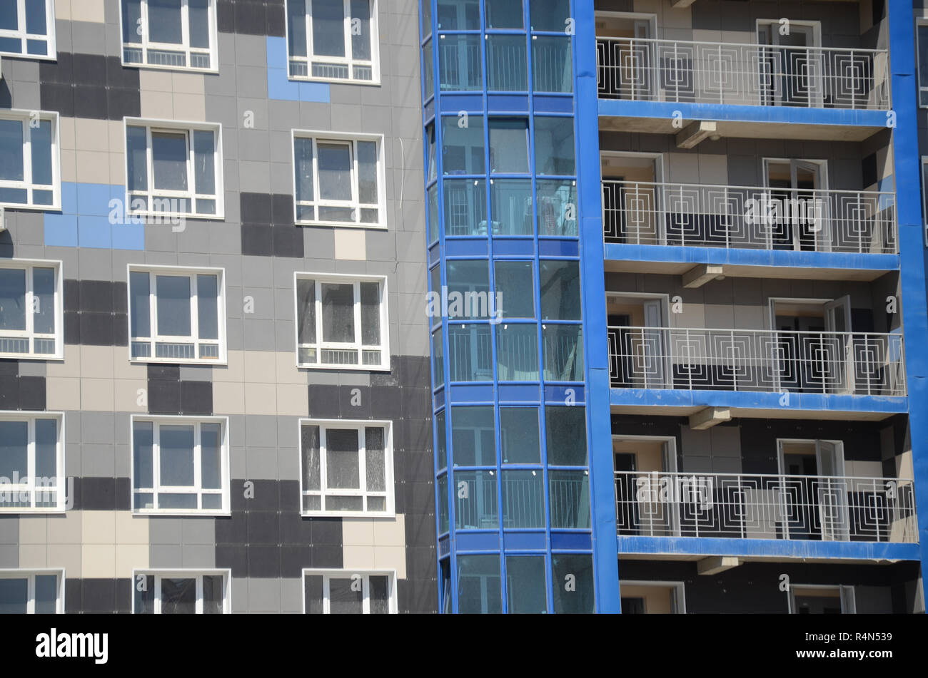 The new house revetted with a multi-colored granite tile Stock Photo ...
