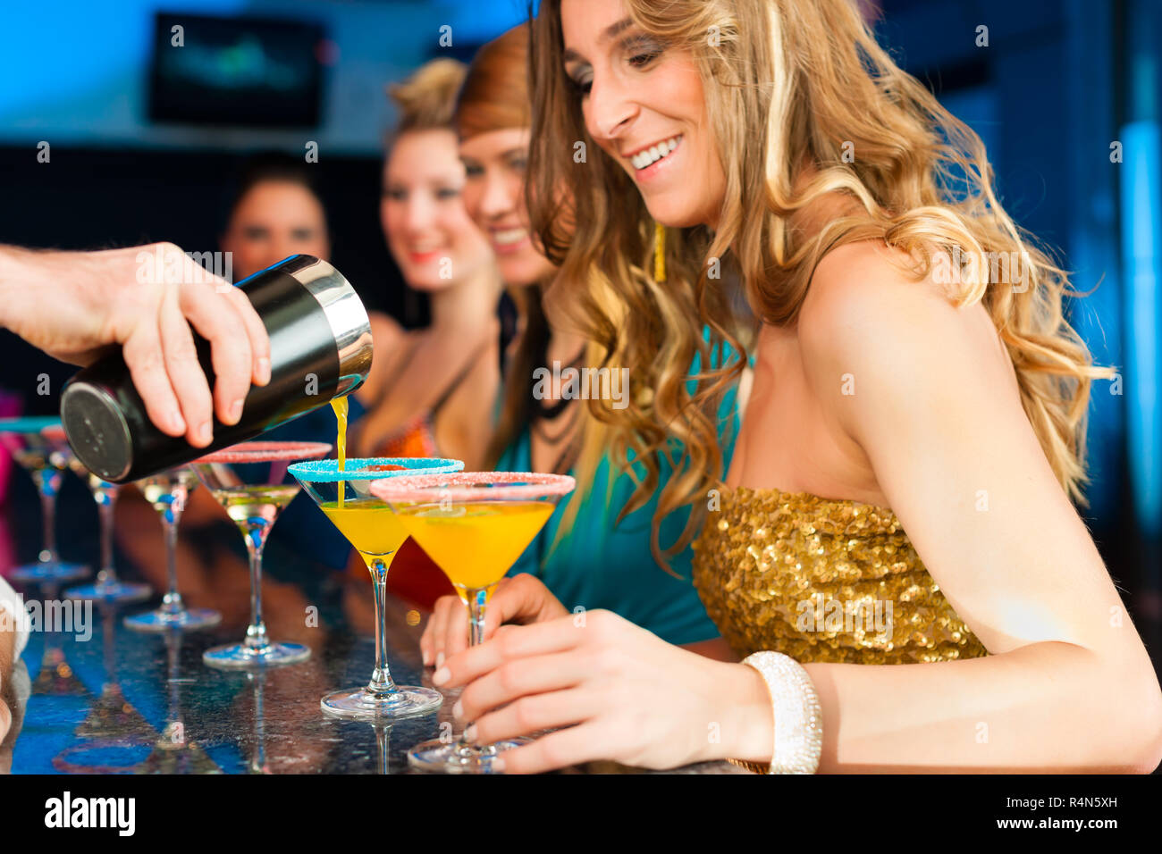 People in club or bar drinking cocktails Stock Photo - Alamy