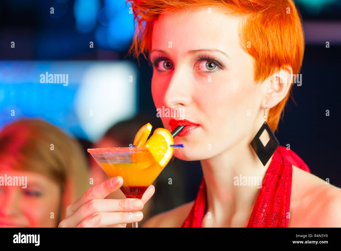 People in club or bar drinking cocktails Stock Photo - Alamy
