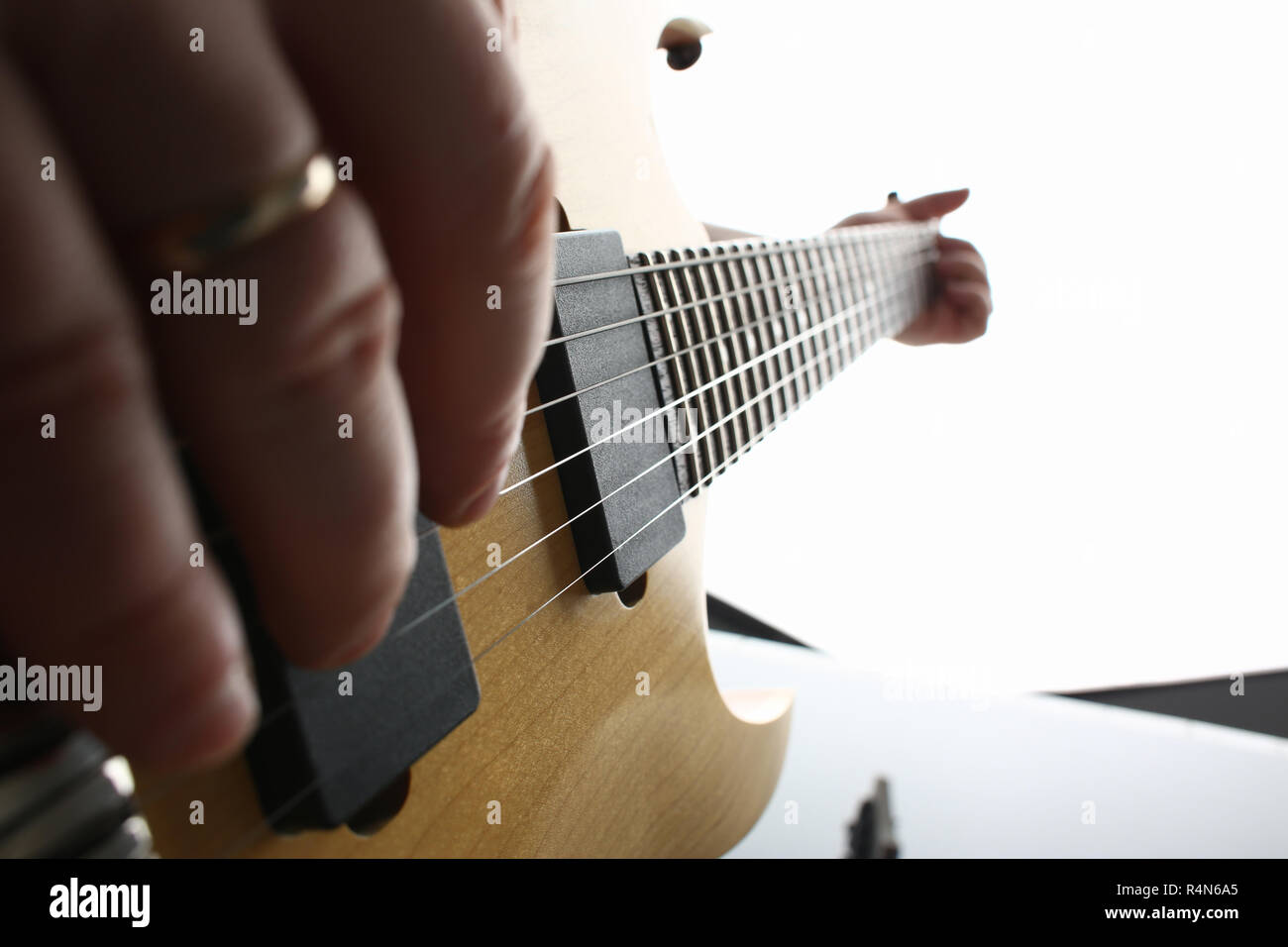 Male hands playing electric guitar on maple fretboard Stock Photo - Alamy