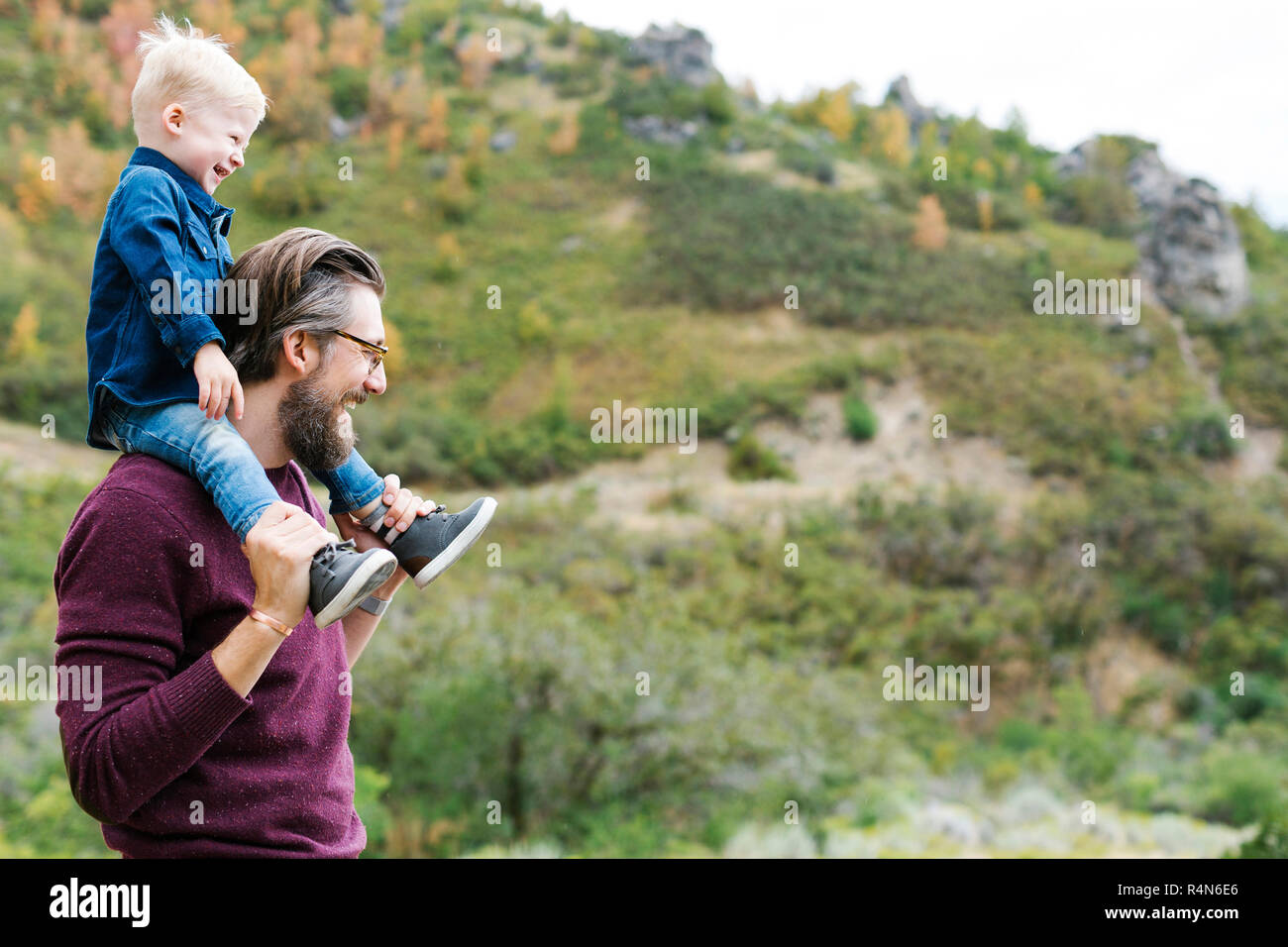 Father giving son piggyback ride Stock Photo - Alamy