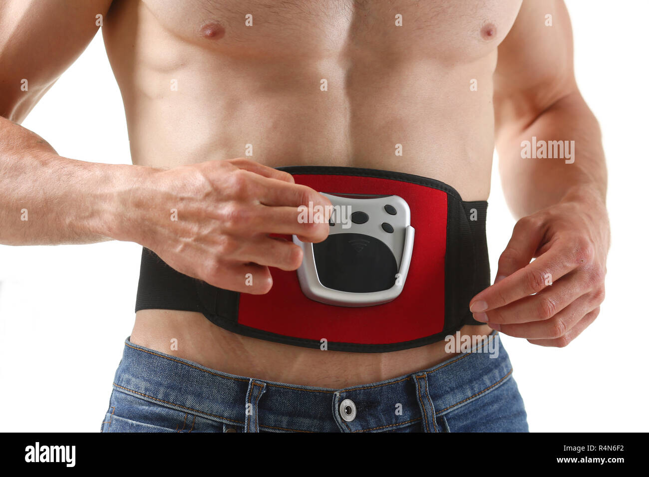 Athletic folded man uses an electric Stock Photo - Alamy
