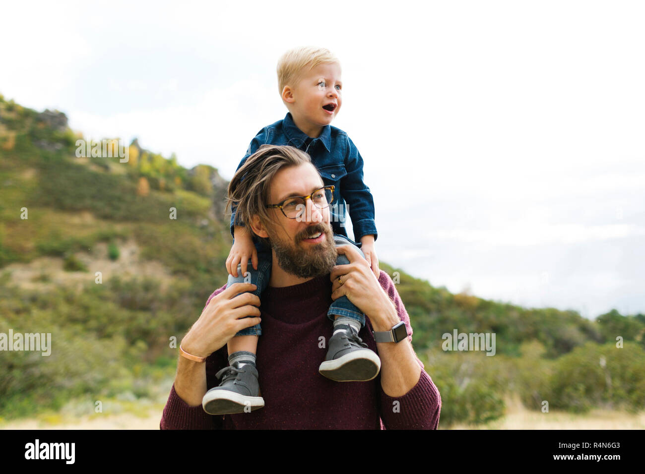 Father giving son piggyback ride Stock Photo - Alamy