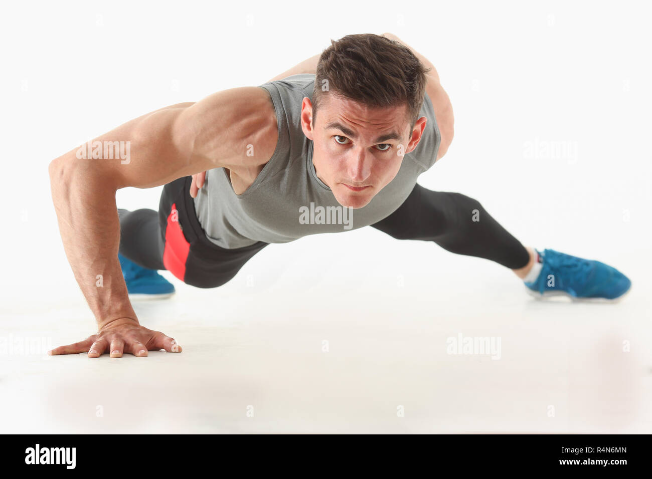 Fitness man wringing from the floor demonstrates Stock Photo - Alamy