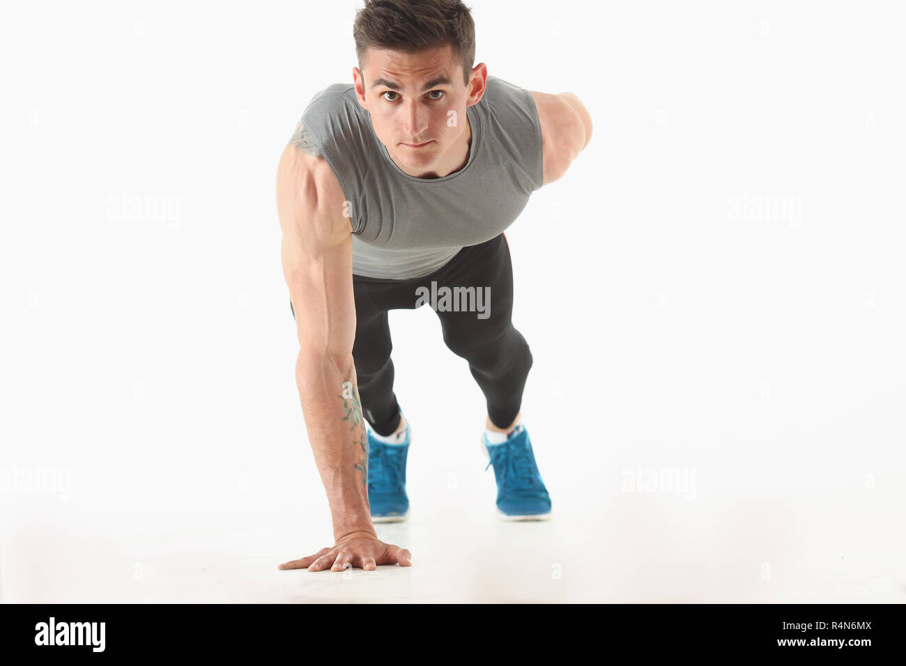 Fitness man wringing from the floor demonstrates Stock Photo - Alamy