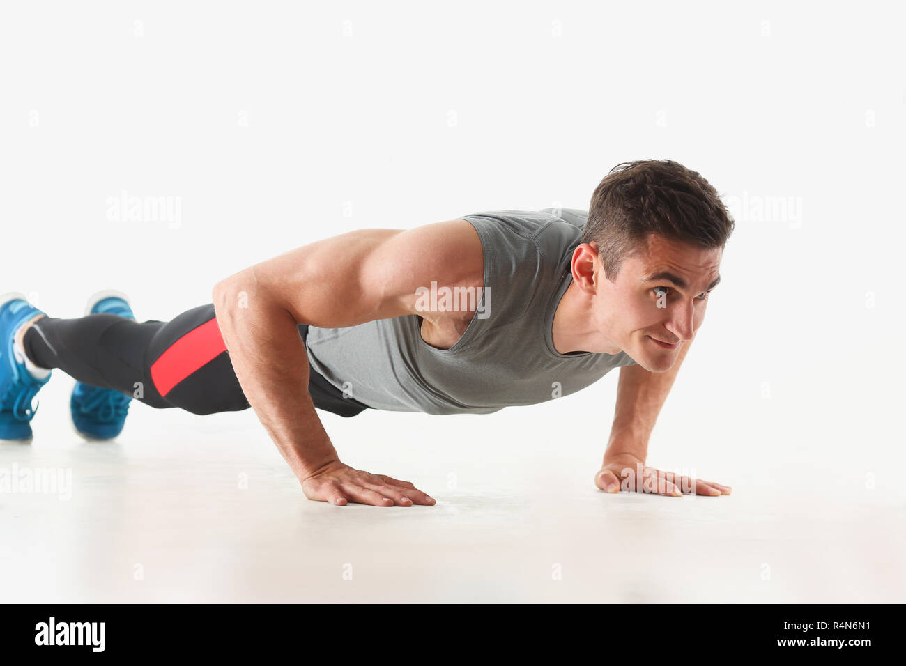 Fitness man wringing from the floor demonstrates Stock Photo - Alamy