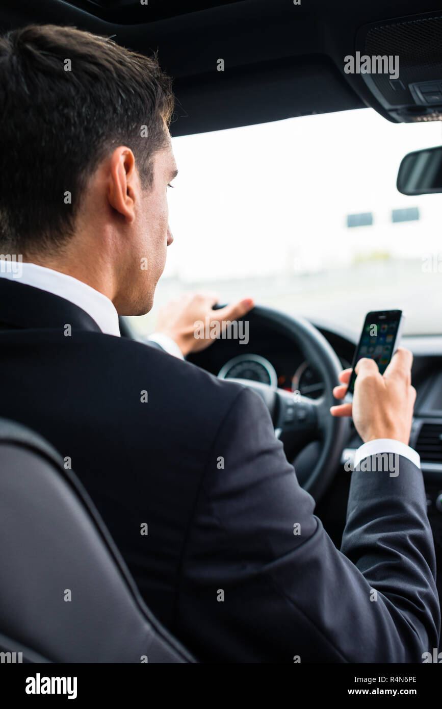 Man texting while driving by car Stock Photo - Alamy