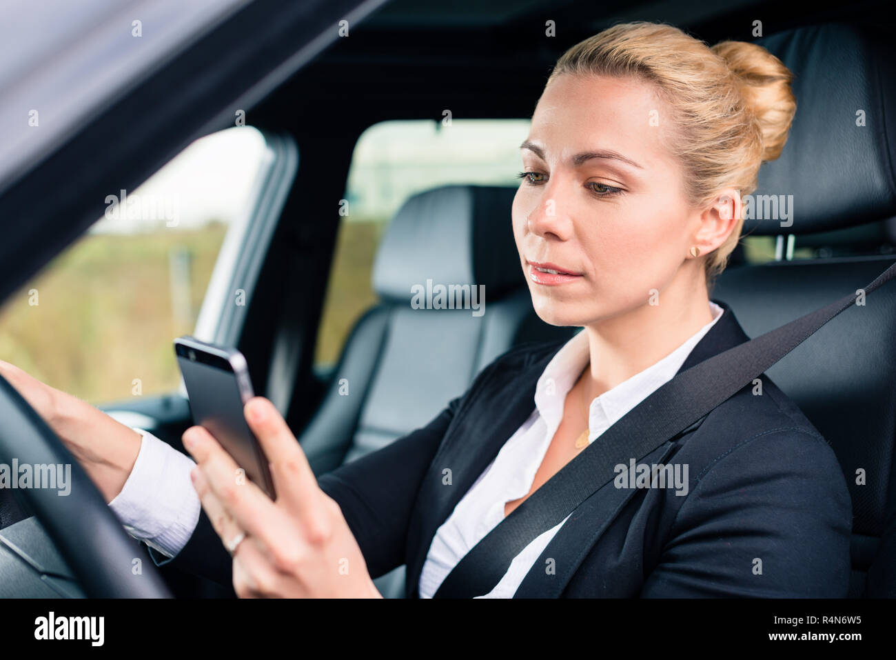 woman texting while driving by car Stock Photo - Alamy