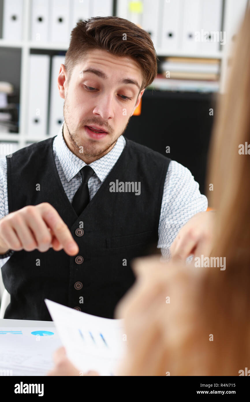 Handsome man in suit offer contract form Stock Photo - Alamy