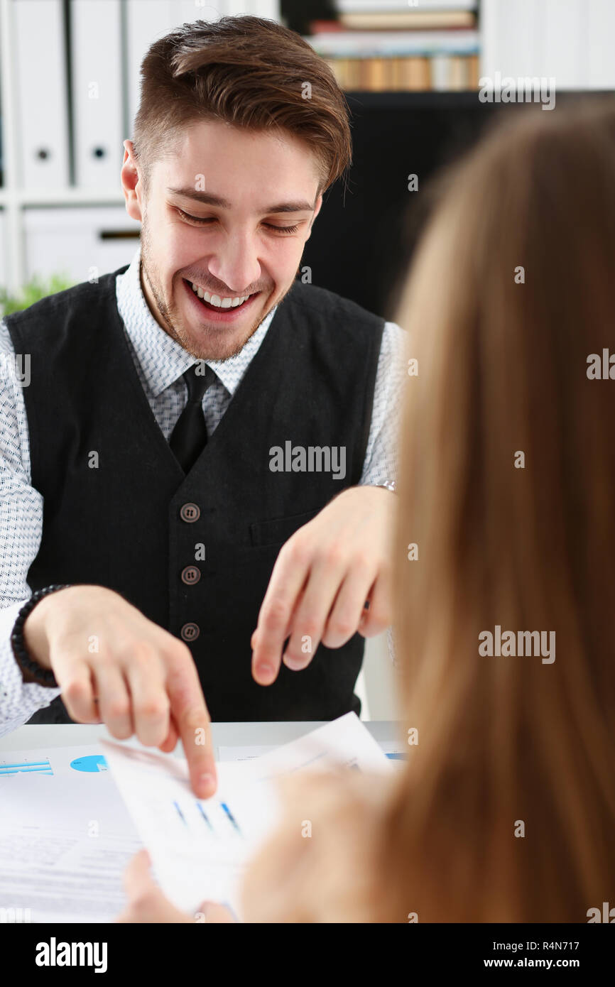 Handsome man in suit offer contract form Stock Photo - Alamy