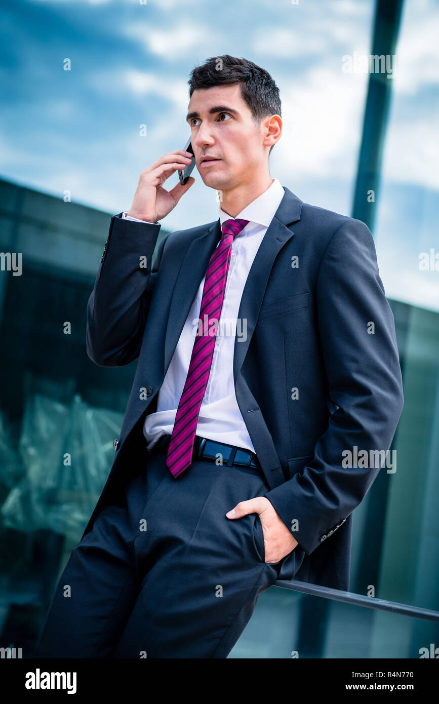 Smart dressed man talking in phone Stock Photo - Alamy