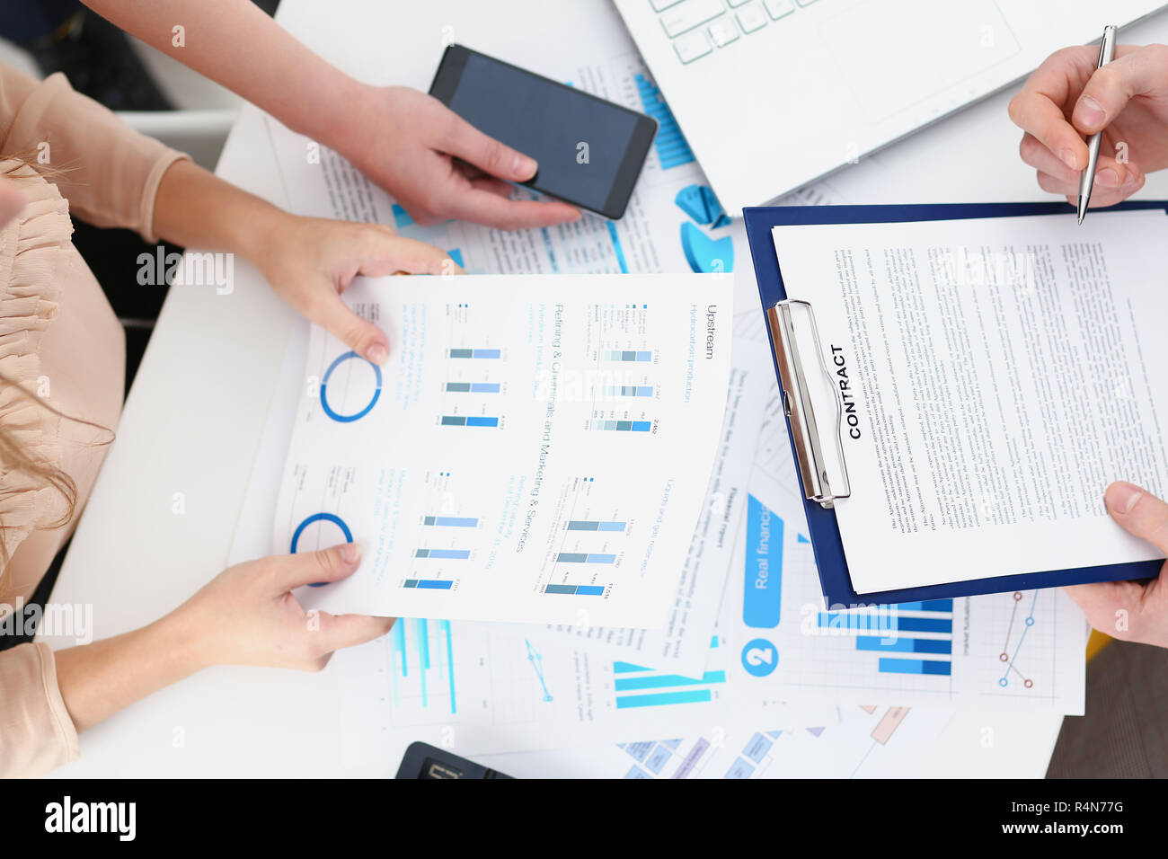Group of people discuss plan at workplace closeup Stock Photo - Alamy