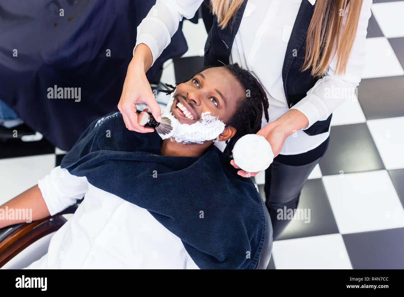 Customer at barber shop with shaving cream Stock Photo - Alamy