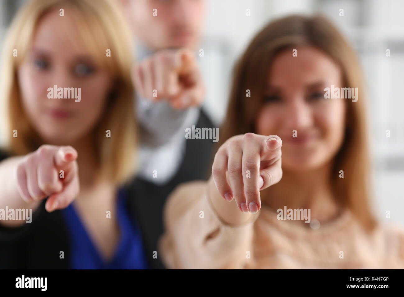 A group of business people pointing their Stock Photo - Alamy