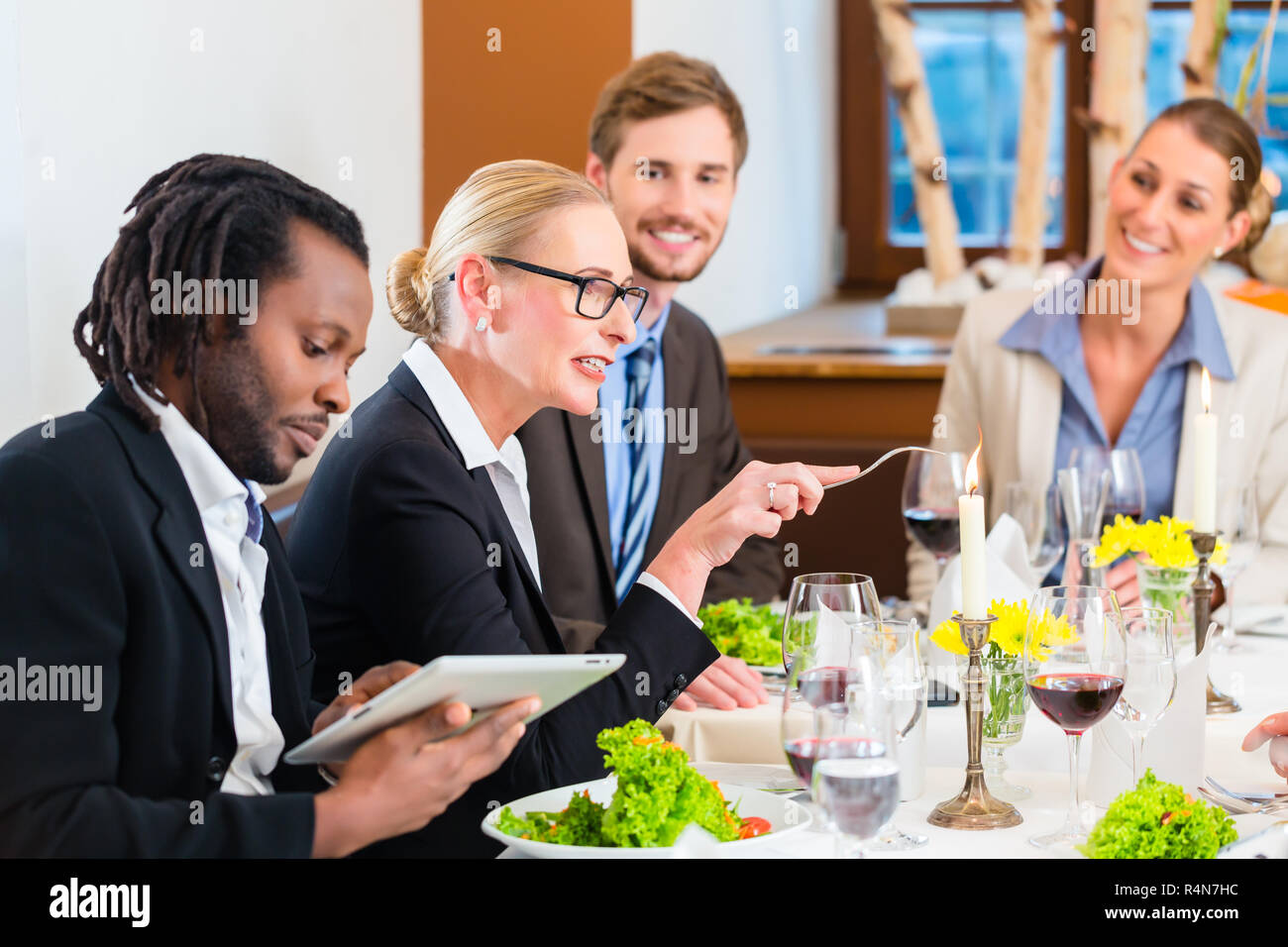 Team at business lunch meeting in restaurant Stock Photo - Alamy