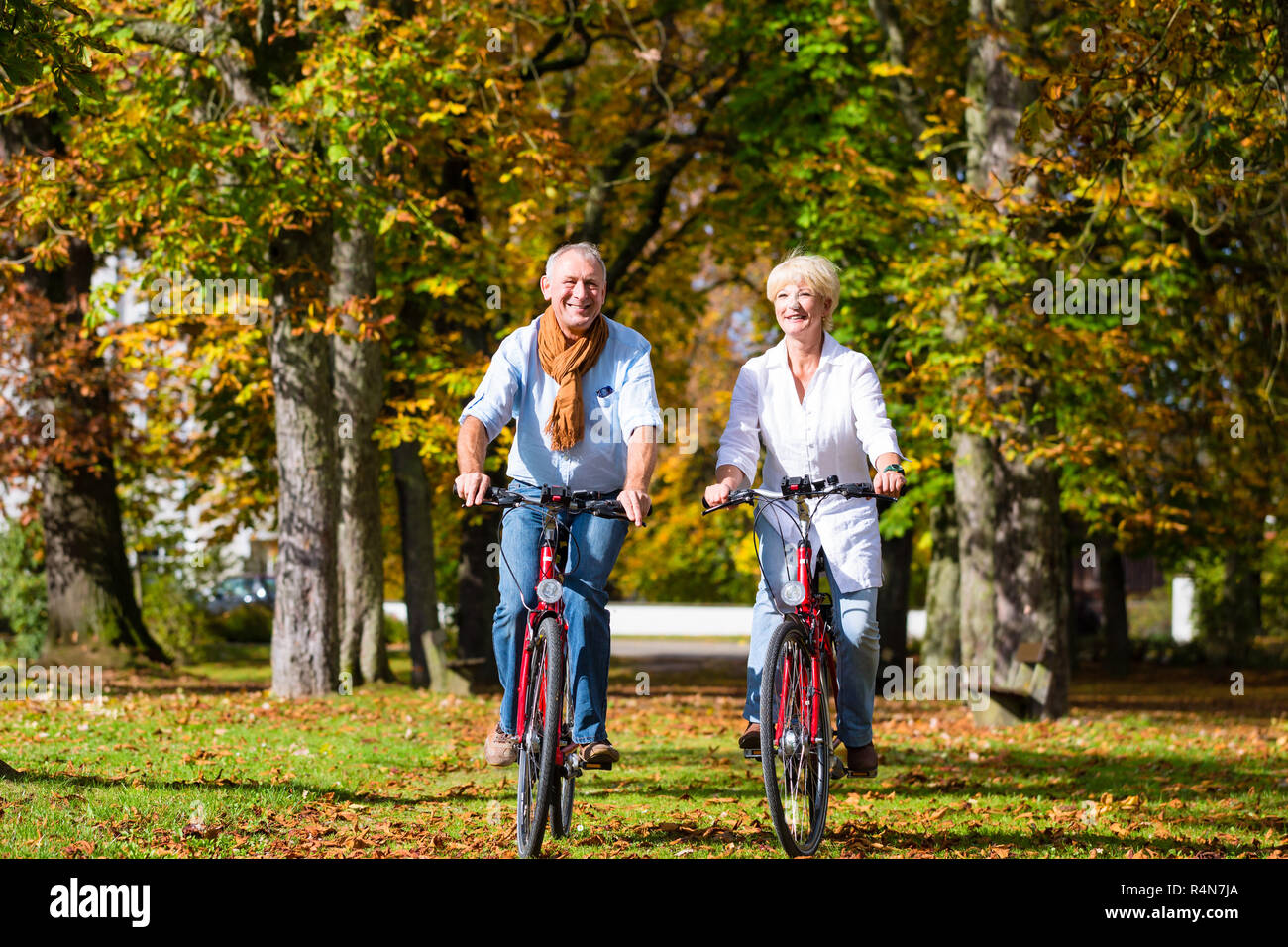 Elderly man riding bicycle bike ride exercise park cycle hi-res stock ...