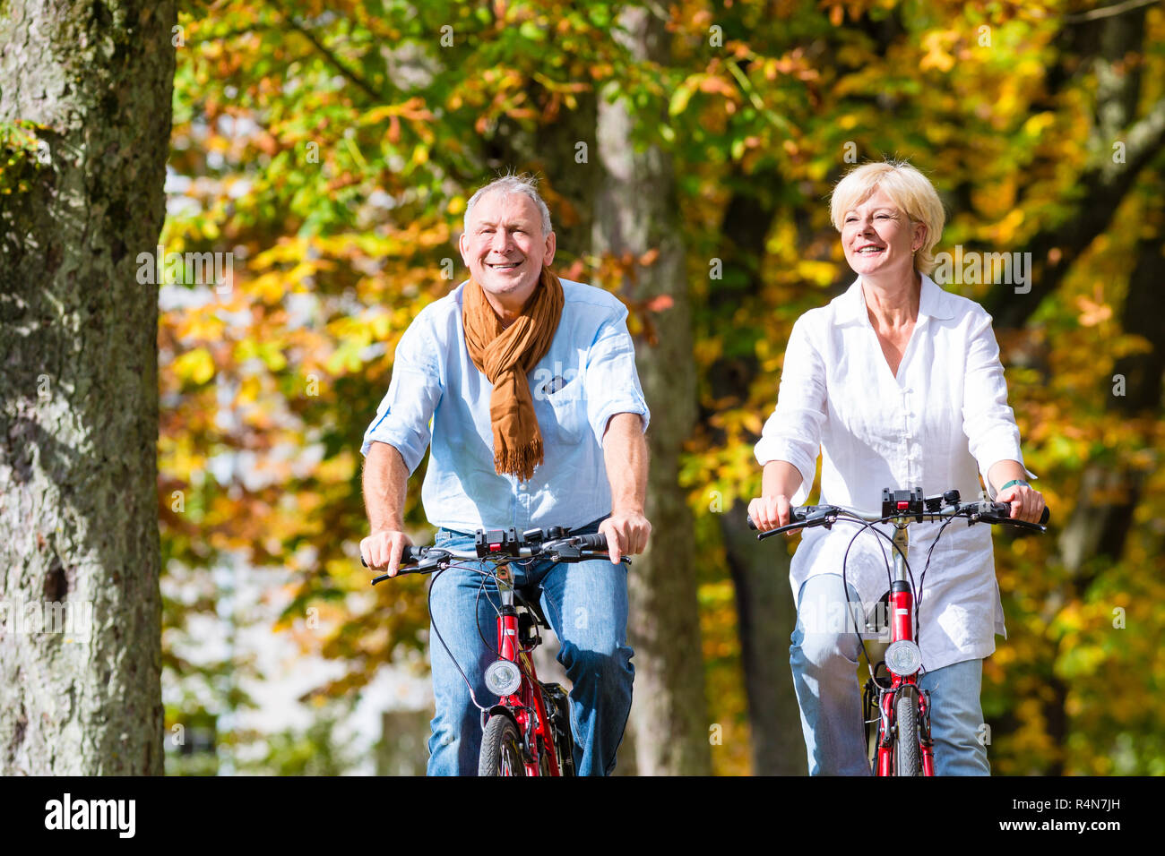 Elderly man riding bicycle bike ride exercise park cycle hi-res stock ...