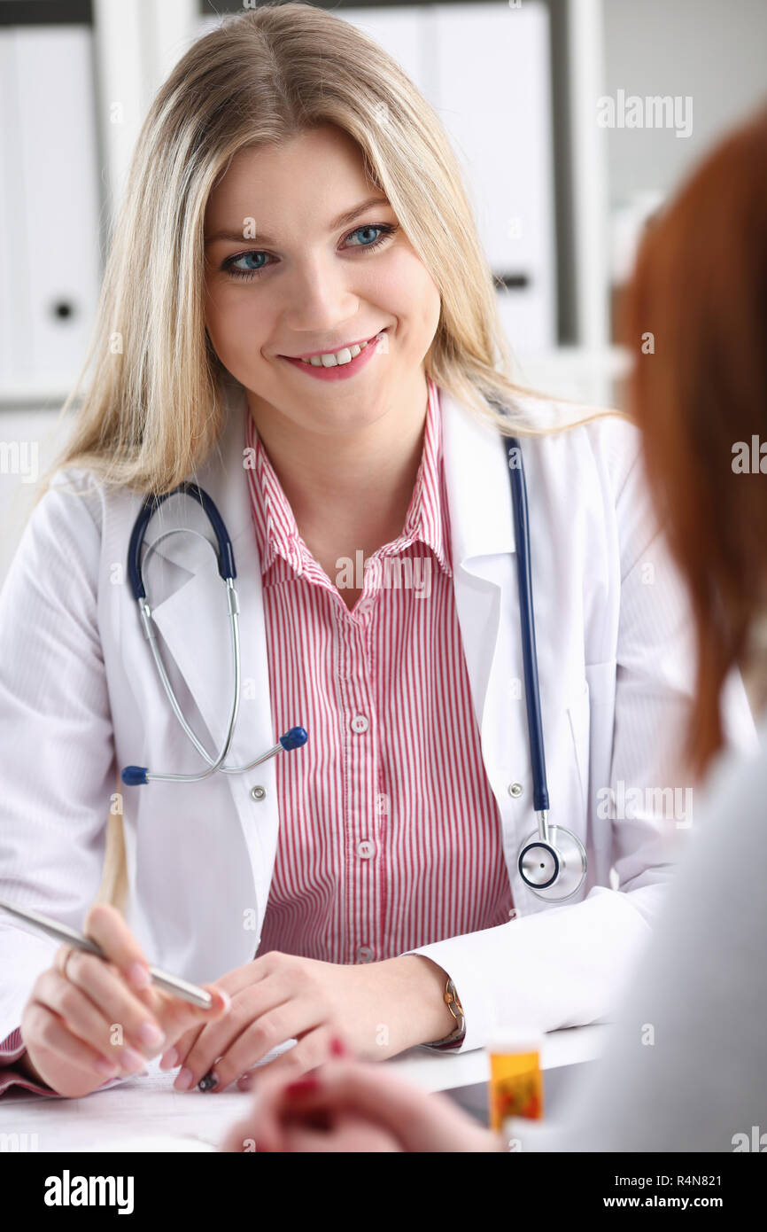 Smiling beautiful female medicine doctor explain diagnosis Stock Photo ...