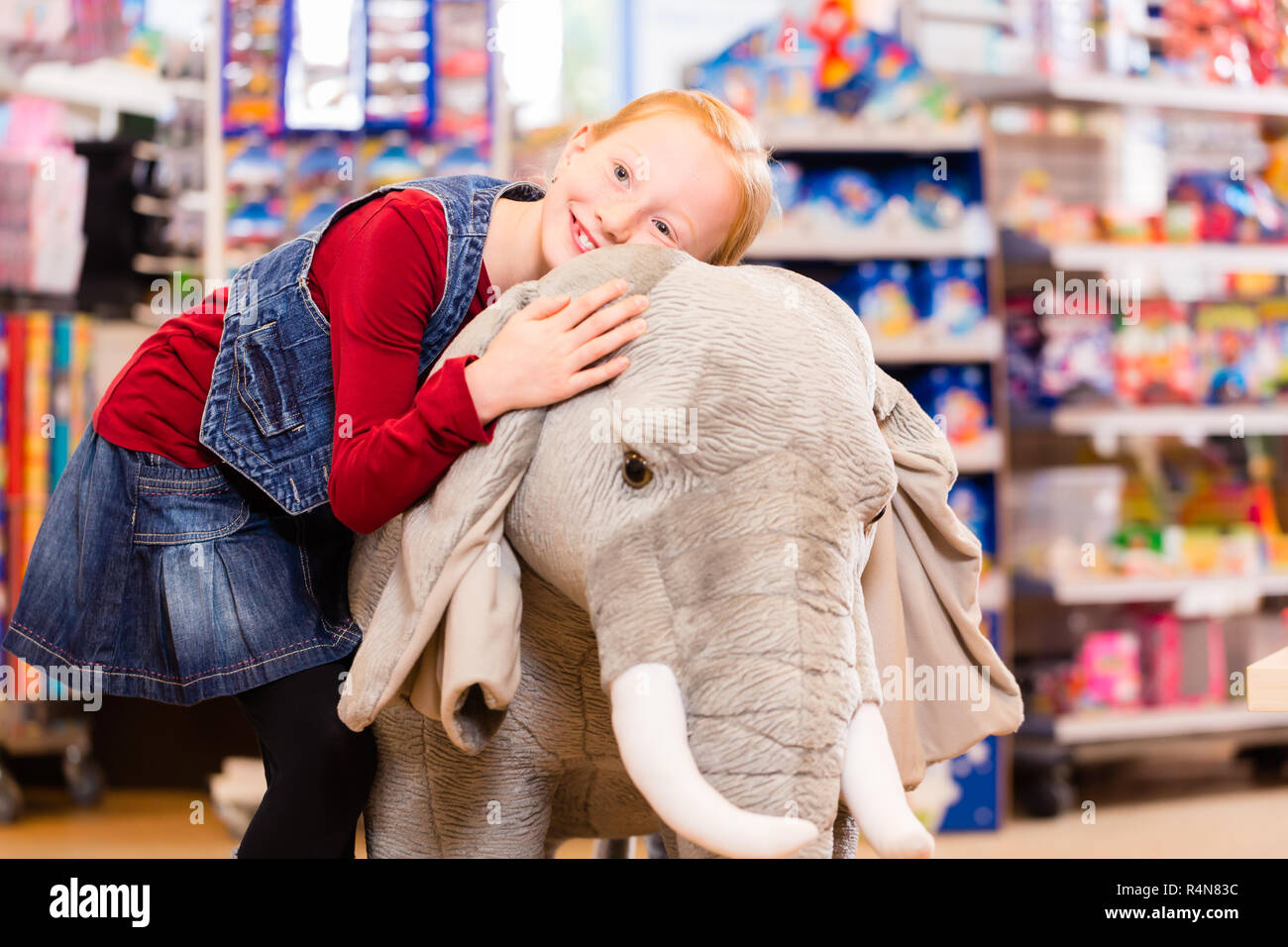 Girl cuddling stuffed animal hi-res stock photography and images - Alamy