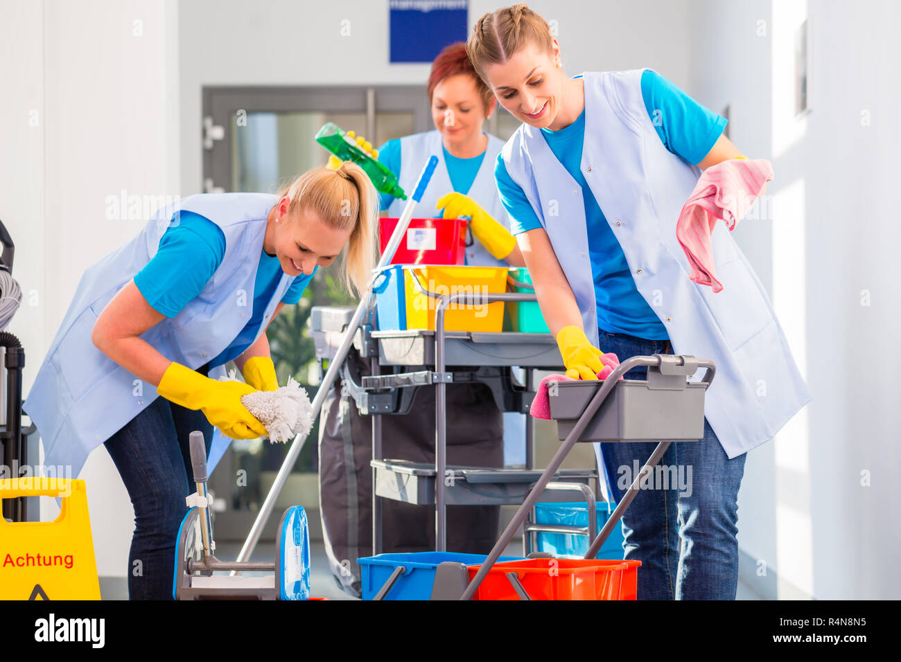 Commercial cleaners doing the job together Stock Photo - Alamy