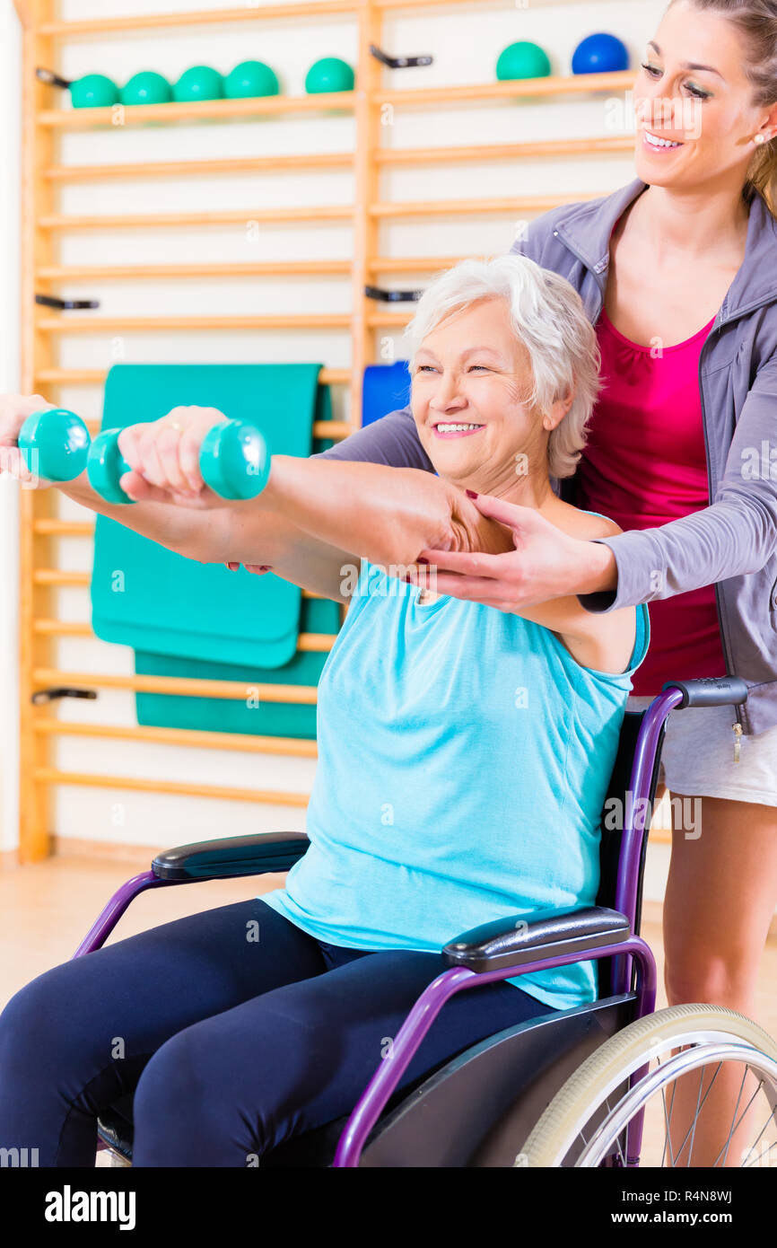 Senior woman in wheel chair doing physical therapy Stock Photo - Alamy
