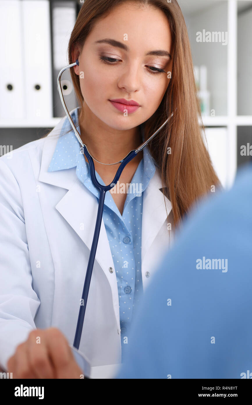 Beautiful female doctor make medic procedure portrait Stock Photo - Alamy