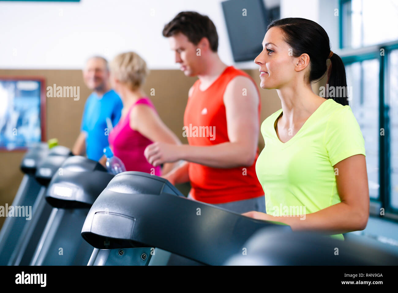 Young woman runs on treadmill hi-res stock photography and images - Alamy