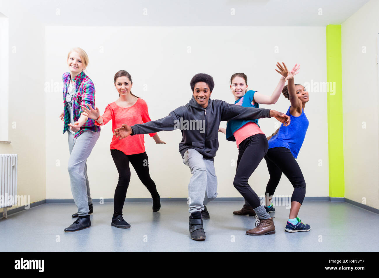 Group of young people having dance class in gym Stock Photo - Alamy