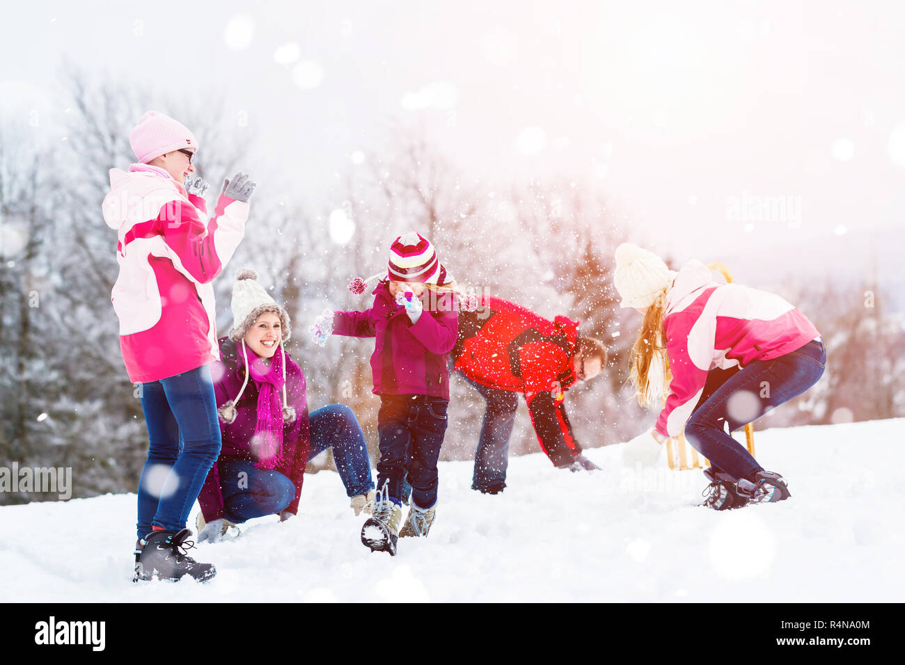 Kids playing snowballs hi-res stock photography and images - Alamy