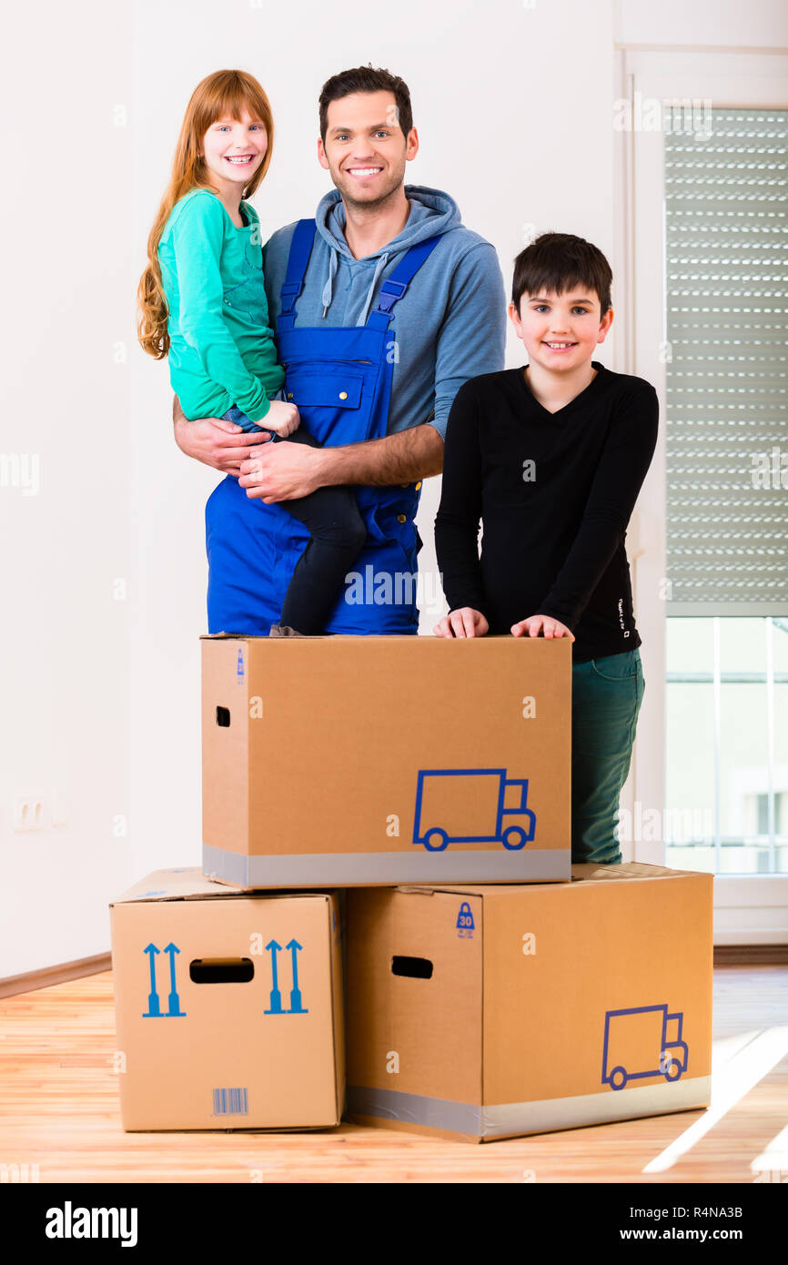 Father with kids moving in new home or house Stock Photo - Alamy