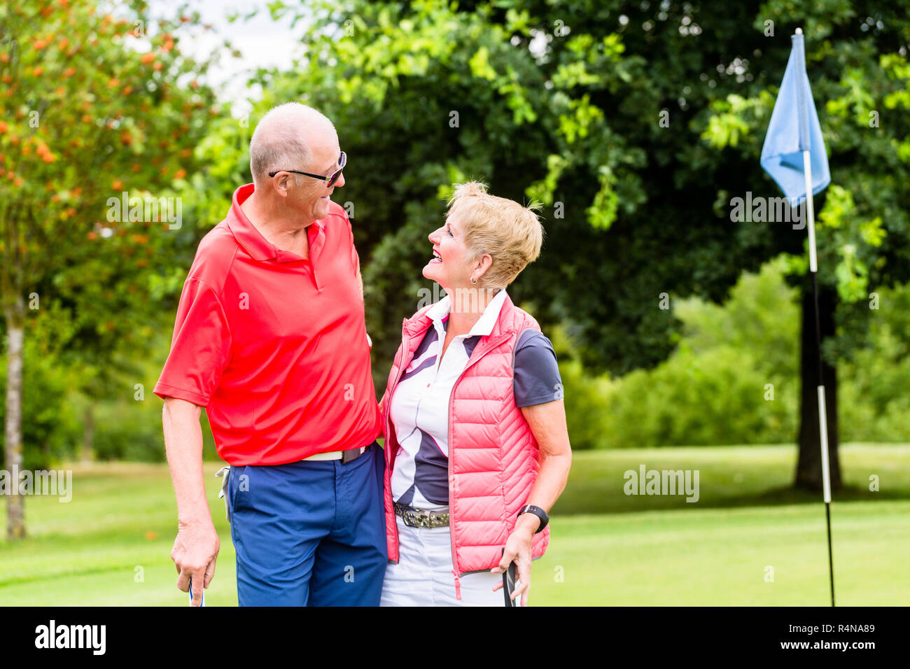 Older woman playing golf hi-res stock photography and images - Alamy