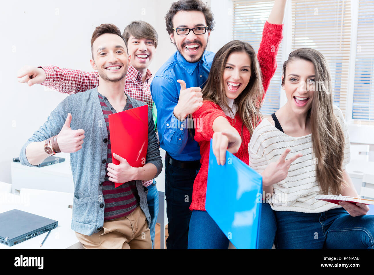 Group of students celebrating success in exams Stock Photo - Alamy