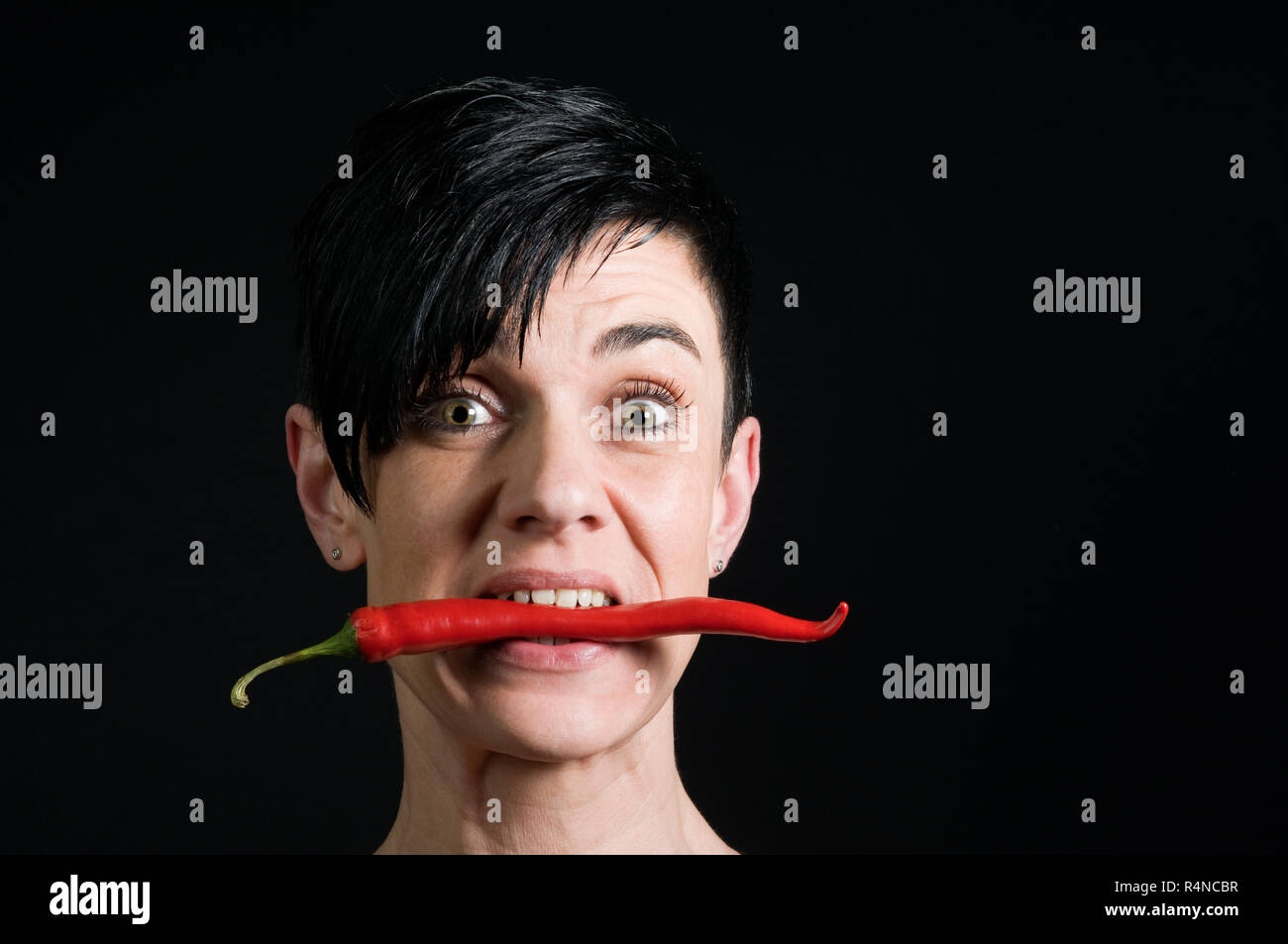 hot chilli in the mouth Stock Photo - Alamy