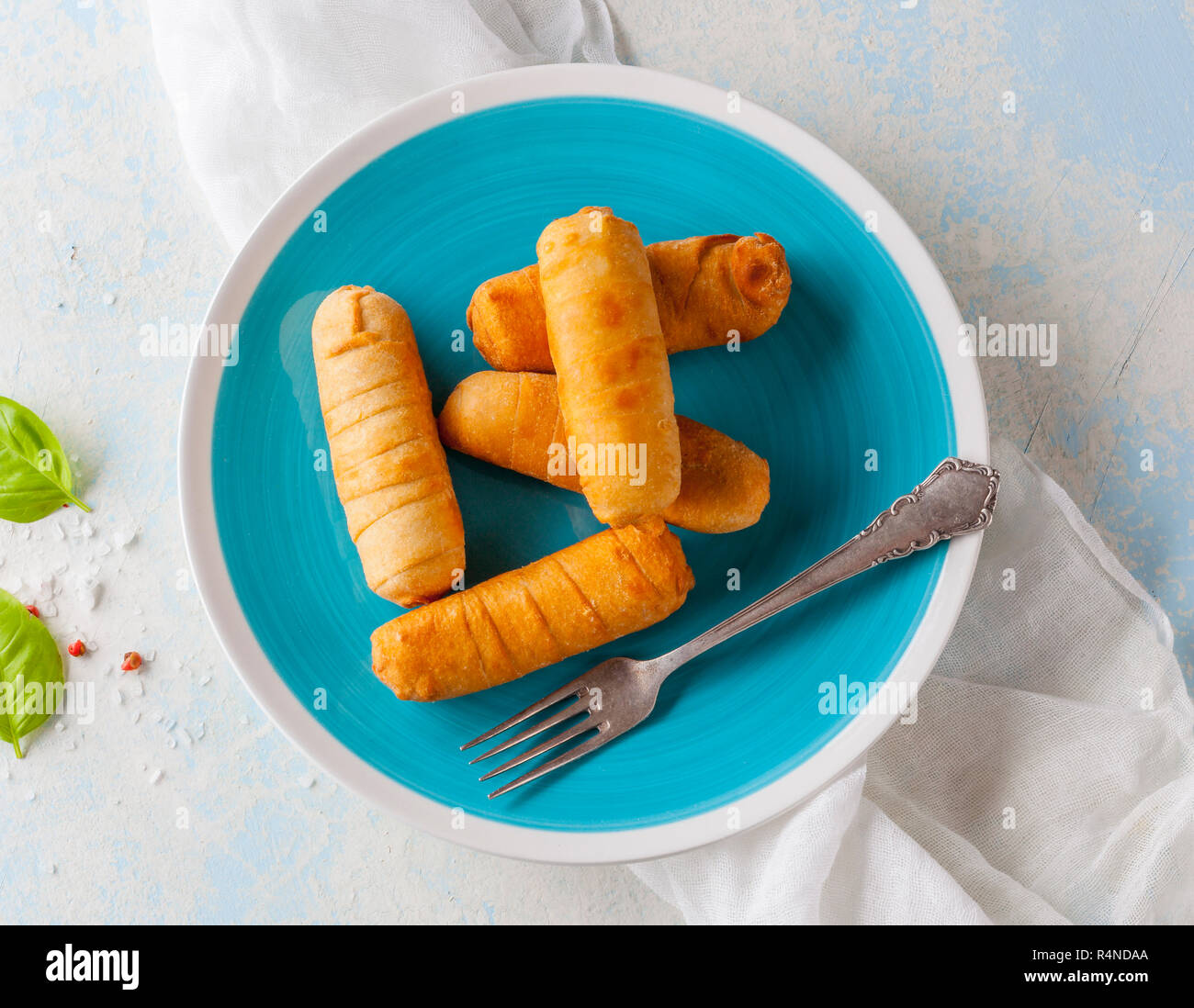 Latin-American appetizers called Tequenos made of fried corn filled ...