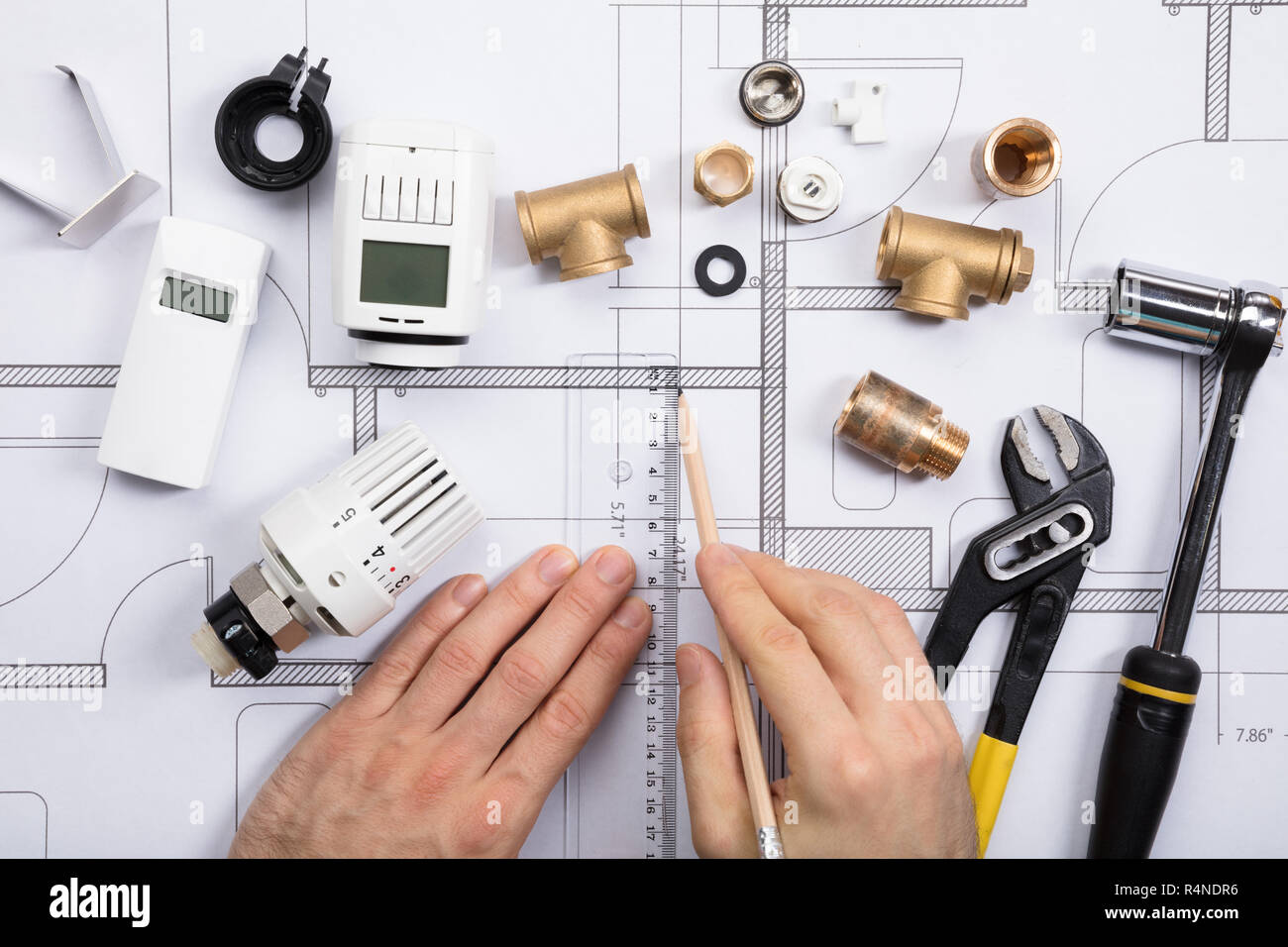 An Architect Drawing Plan On Blueprint With Ruler And Pencil Stock ...