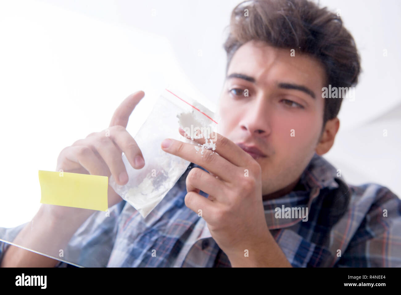 Drug addict sniffing cocaine narcotic Stock Photo - Alamy