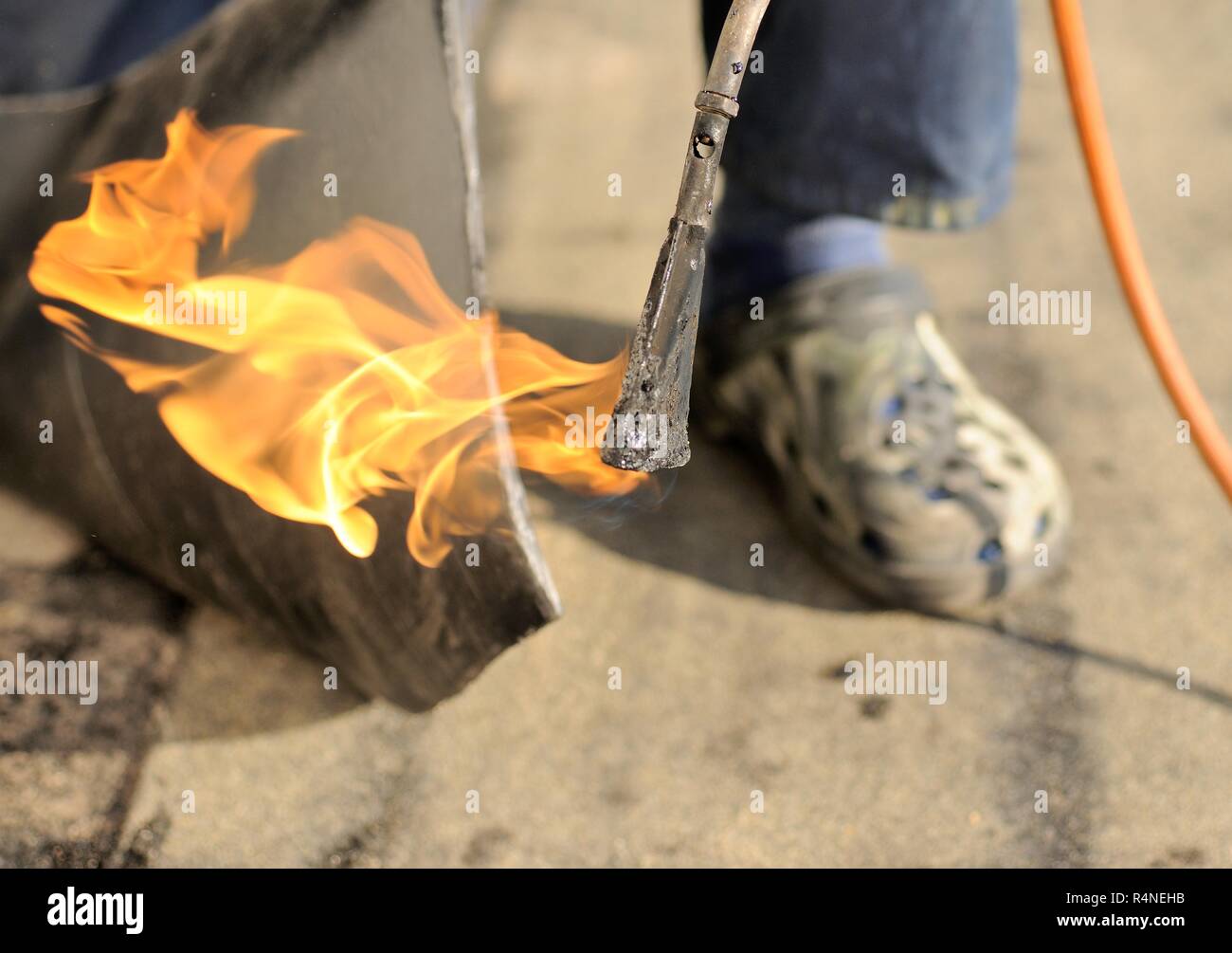 Worker with fire Stock Photo - Alamy