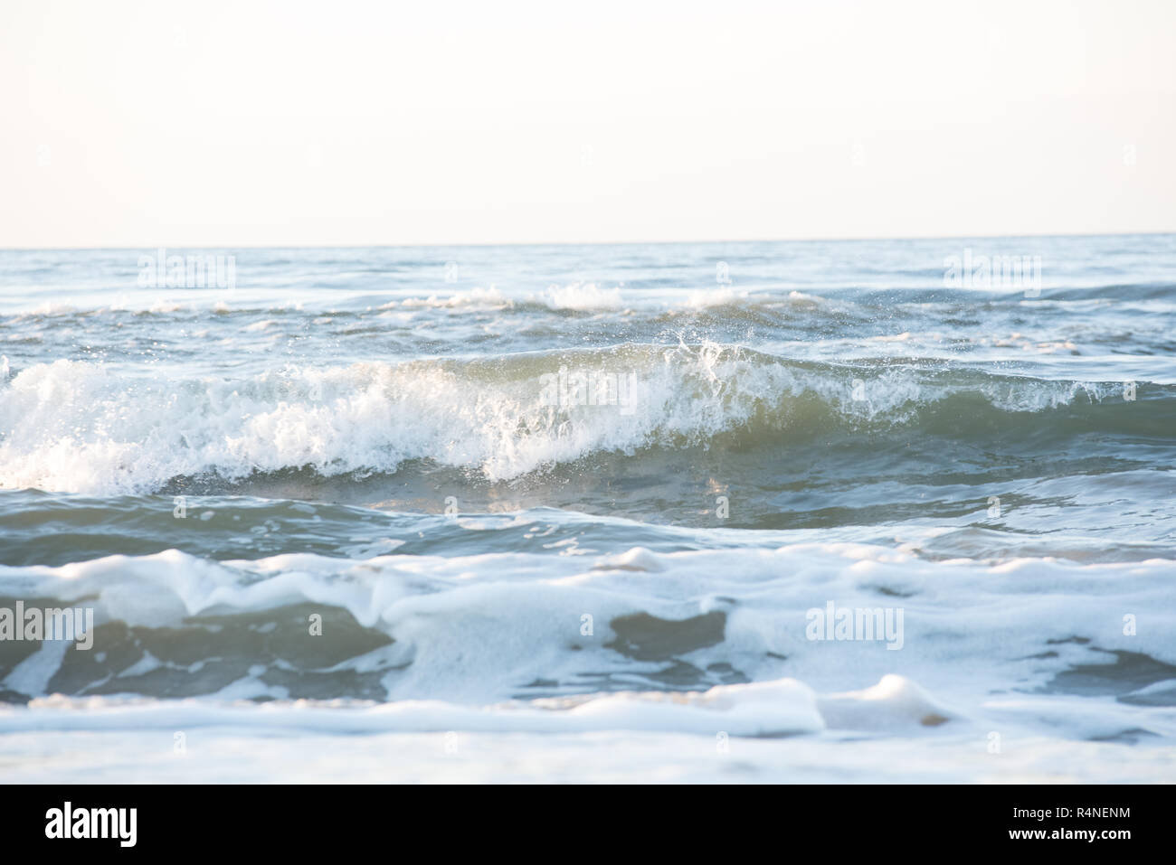 Sea wave breaking Stock Photo - Alamy