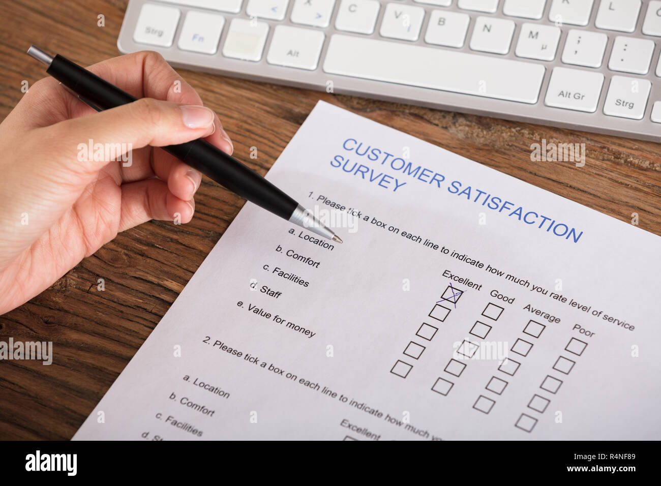 Businesswoman Filling The Customer Satisfaction Survey Form Stock Photo ...