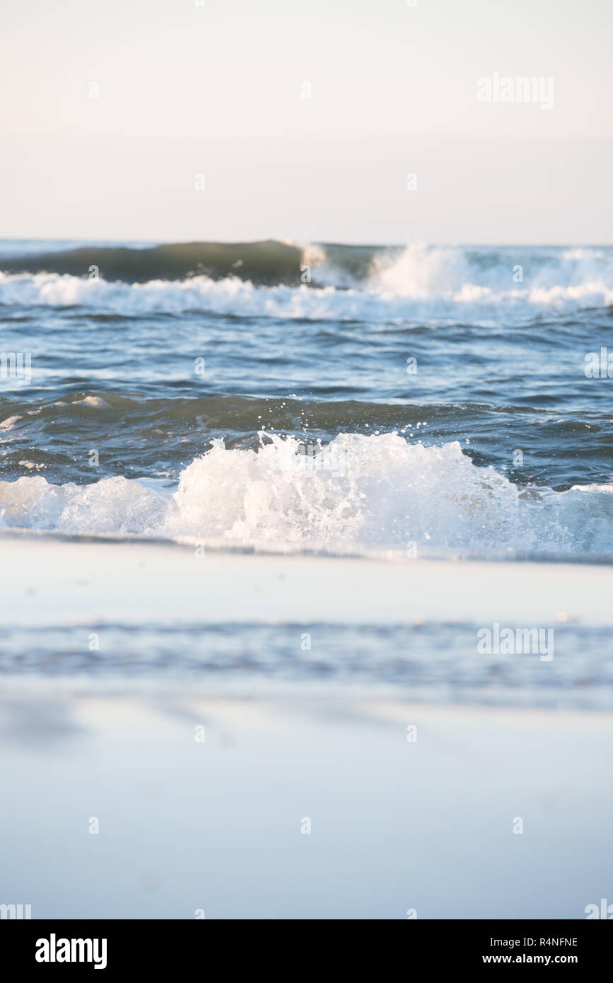 Sea wave breaking Stock Photo - Alamy
