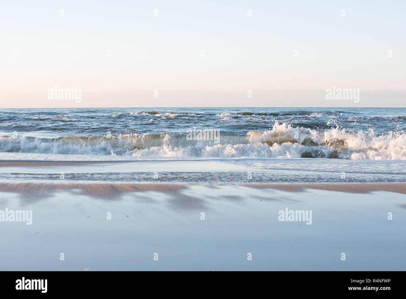 Sea wave breaking Stock Photo - Alamy