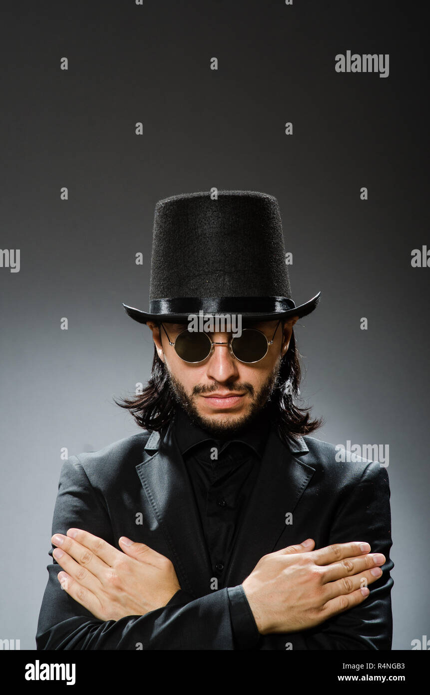 Vintage concept with man wearing black top hat Stock Photo - Alamy