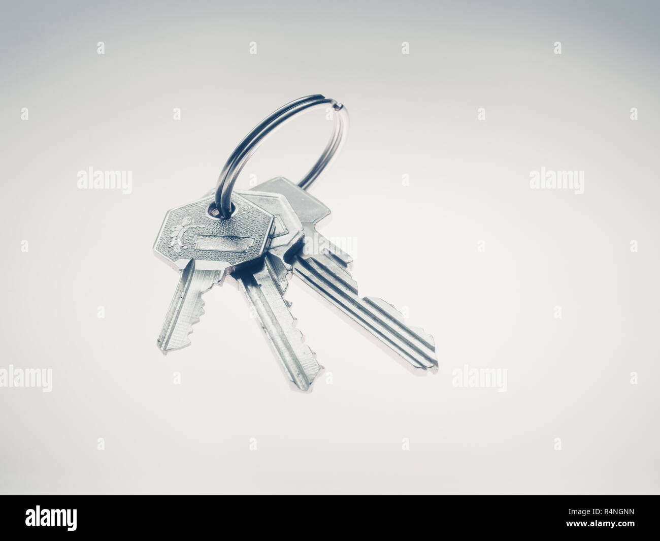 A set of metal keys o a white background Stock Photo - Alamy