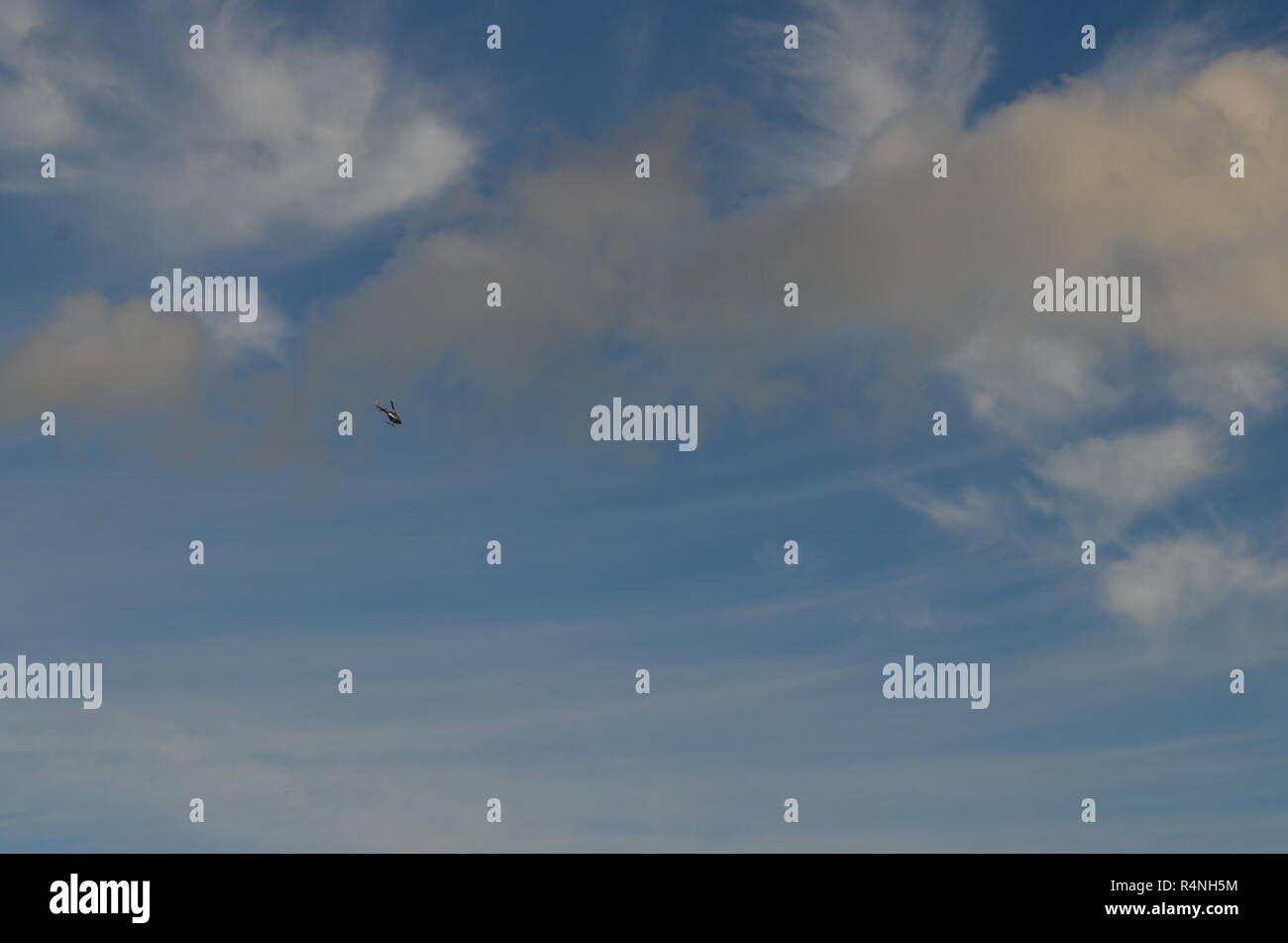helicopter flying in the distance Stock Photo - Alamy