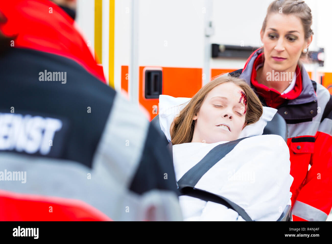 Injured woman on stretcher hi-res stock photography and images - Alamy