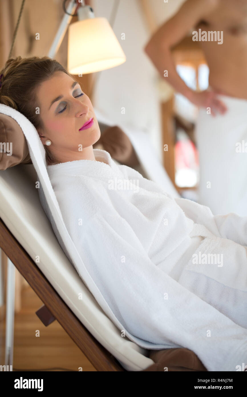 Woman relaxing on wellness spa lounger Stock Photo - Alamy