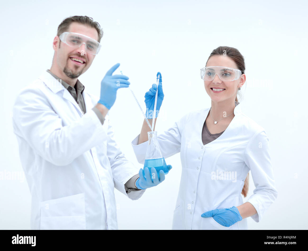 two cheerful scientists biologist on a light background Stock Photo - Alamy