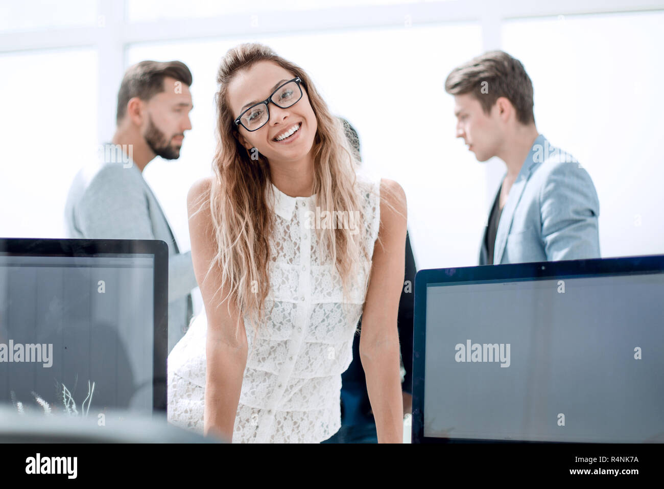 Young employee standing near hi-res stock photography and images - Alamy
